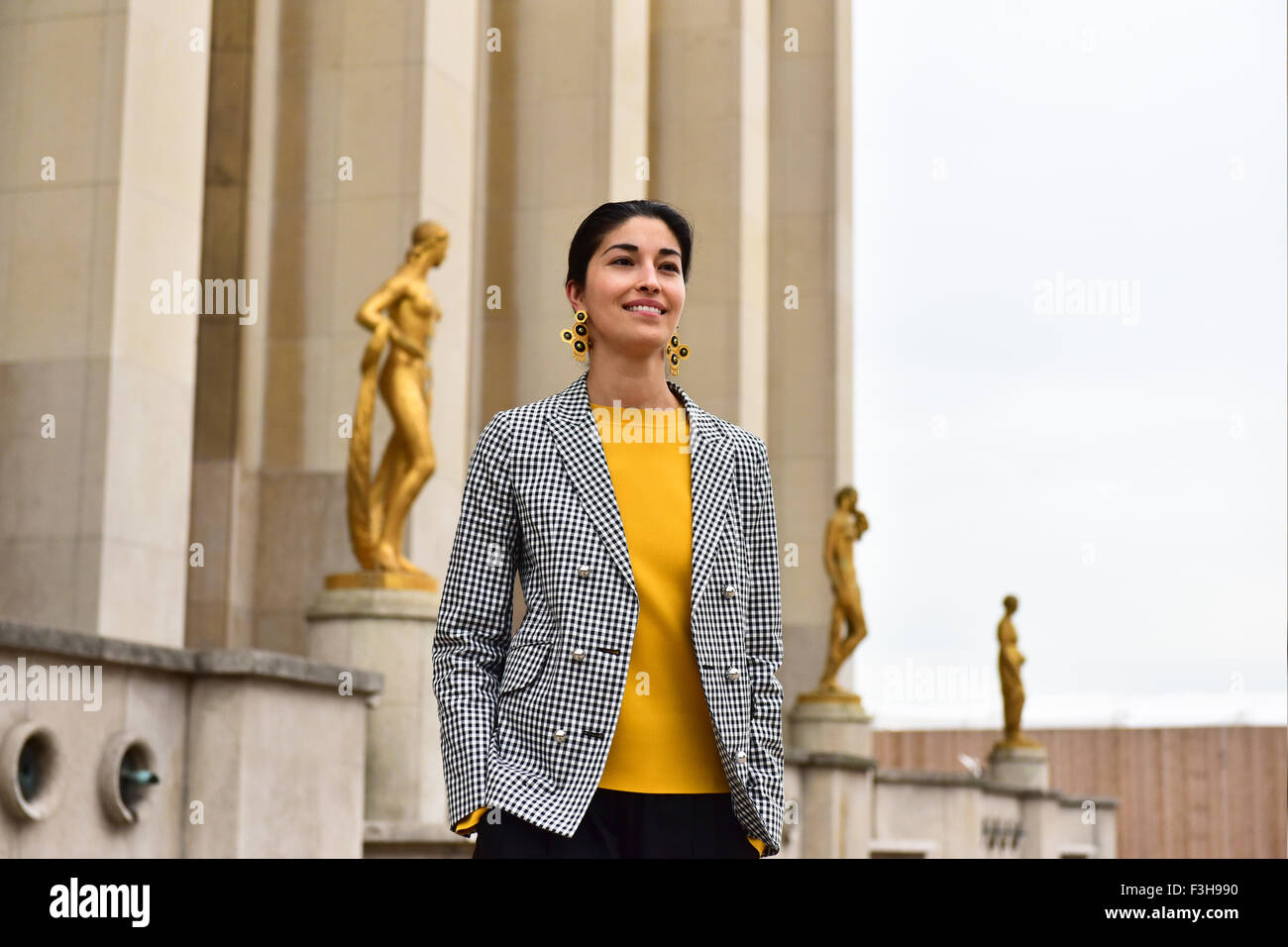 Designer Caroline Issa posing outside of the Sakai runway show during ...