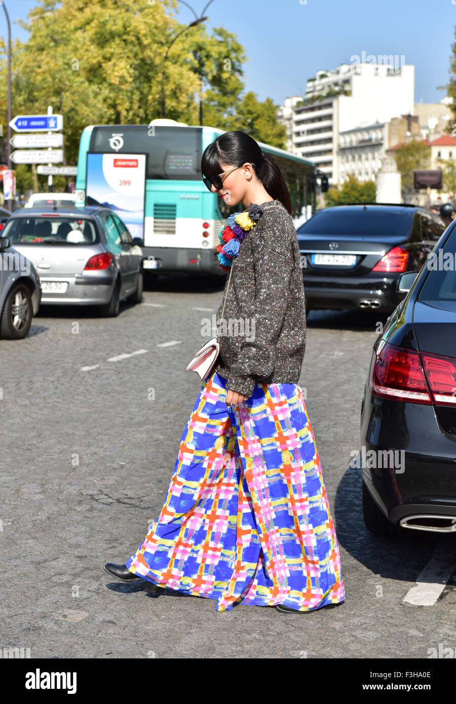 Blogger Laura Comolli posing outside of the Celine runway show during ...