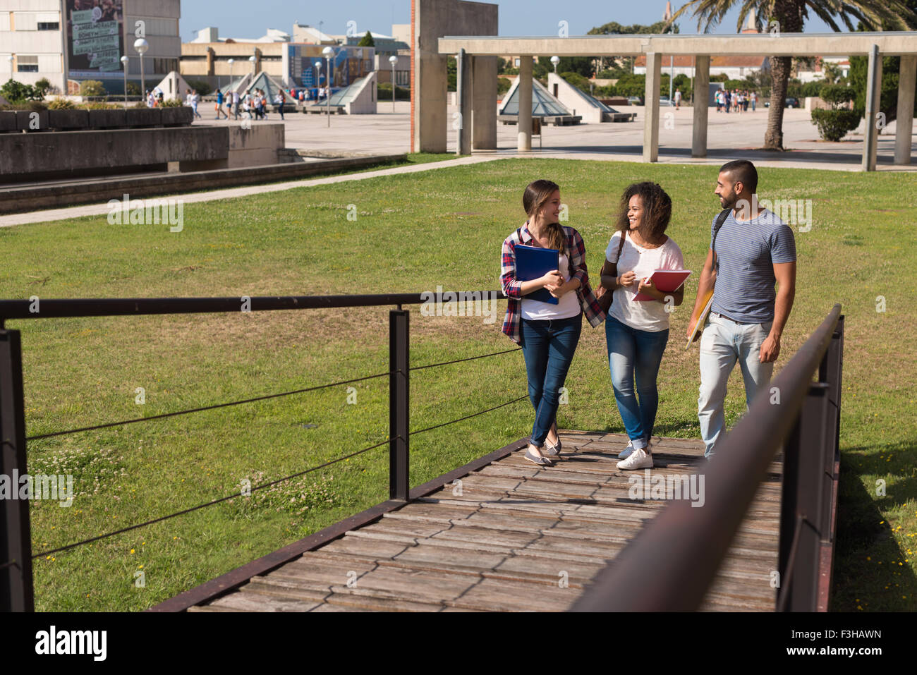 Group of students walking on school campus Stock Photo - Alamy