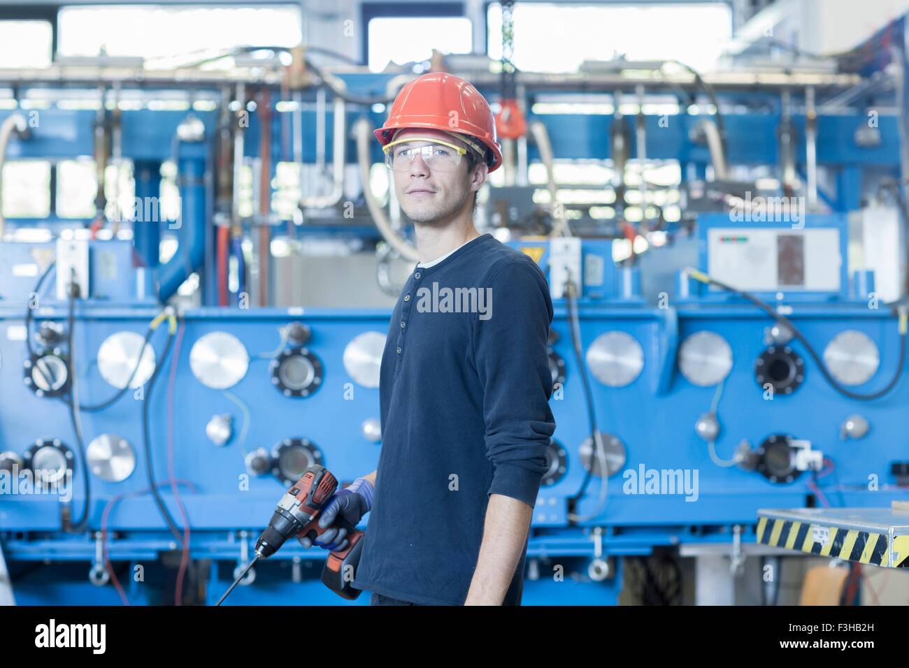 Portrait of factory engineer and industrial machinery Stock Photo - Alamy