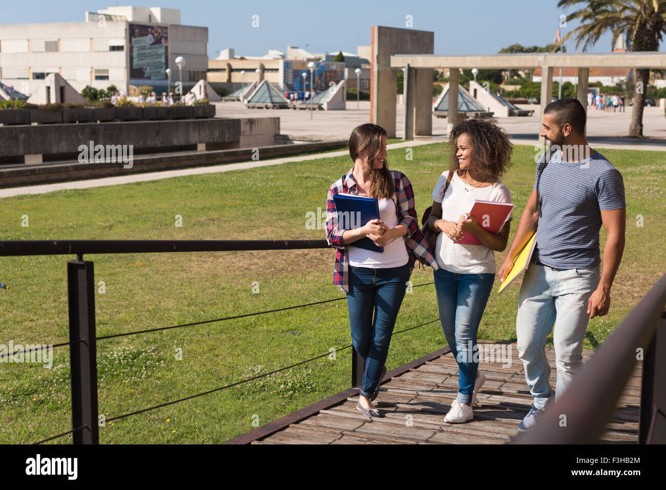 Group of students walking on school campus Stock Photo - Alamy