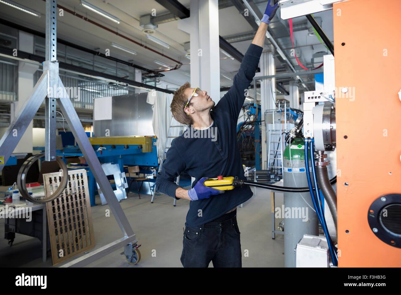 Factory technician testing control panel Stock Photo - Alamy