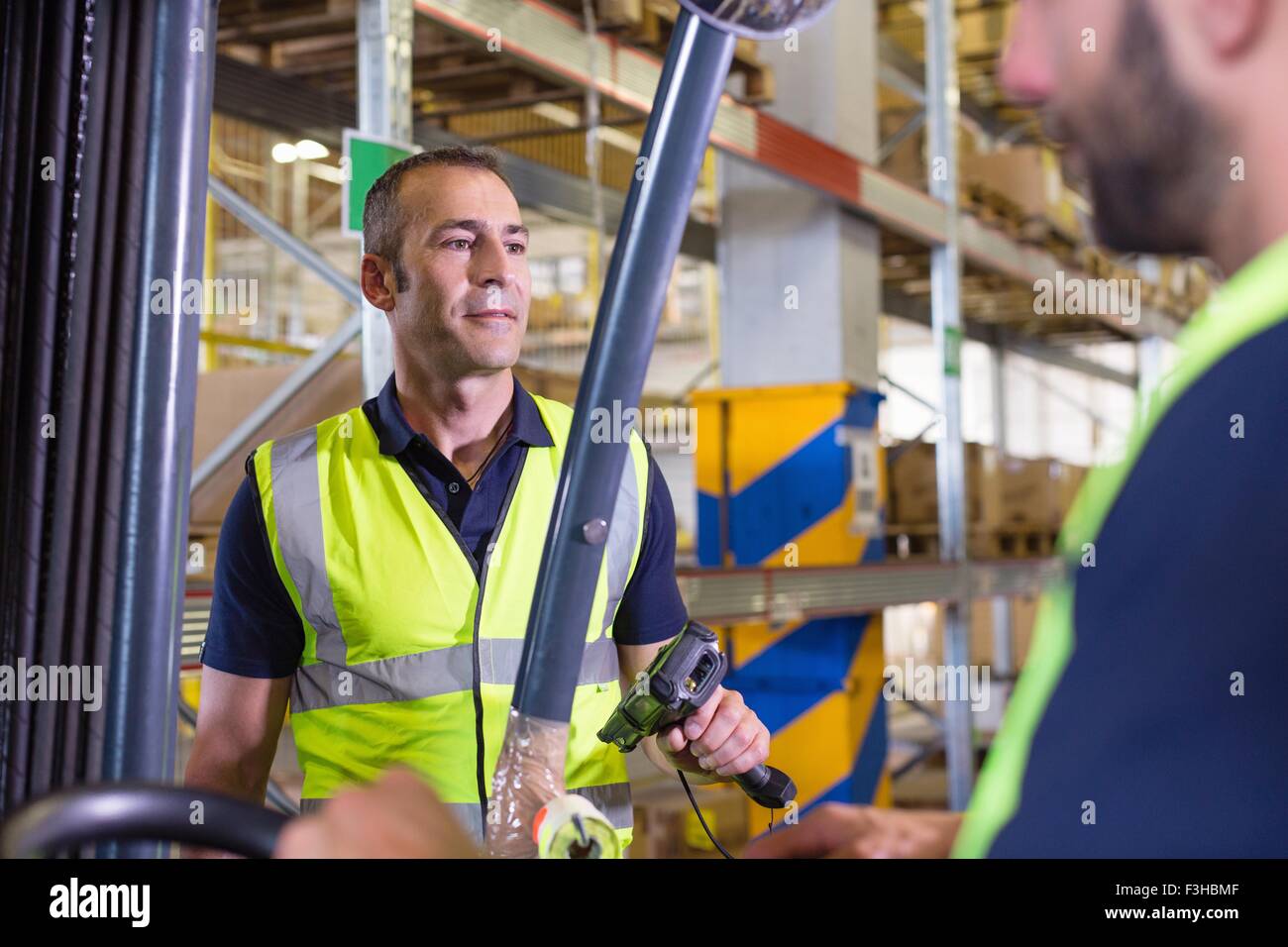 Supervisor instructing male forklift truck hi-res stock photography and ...