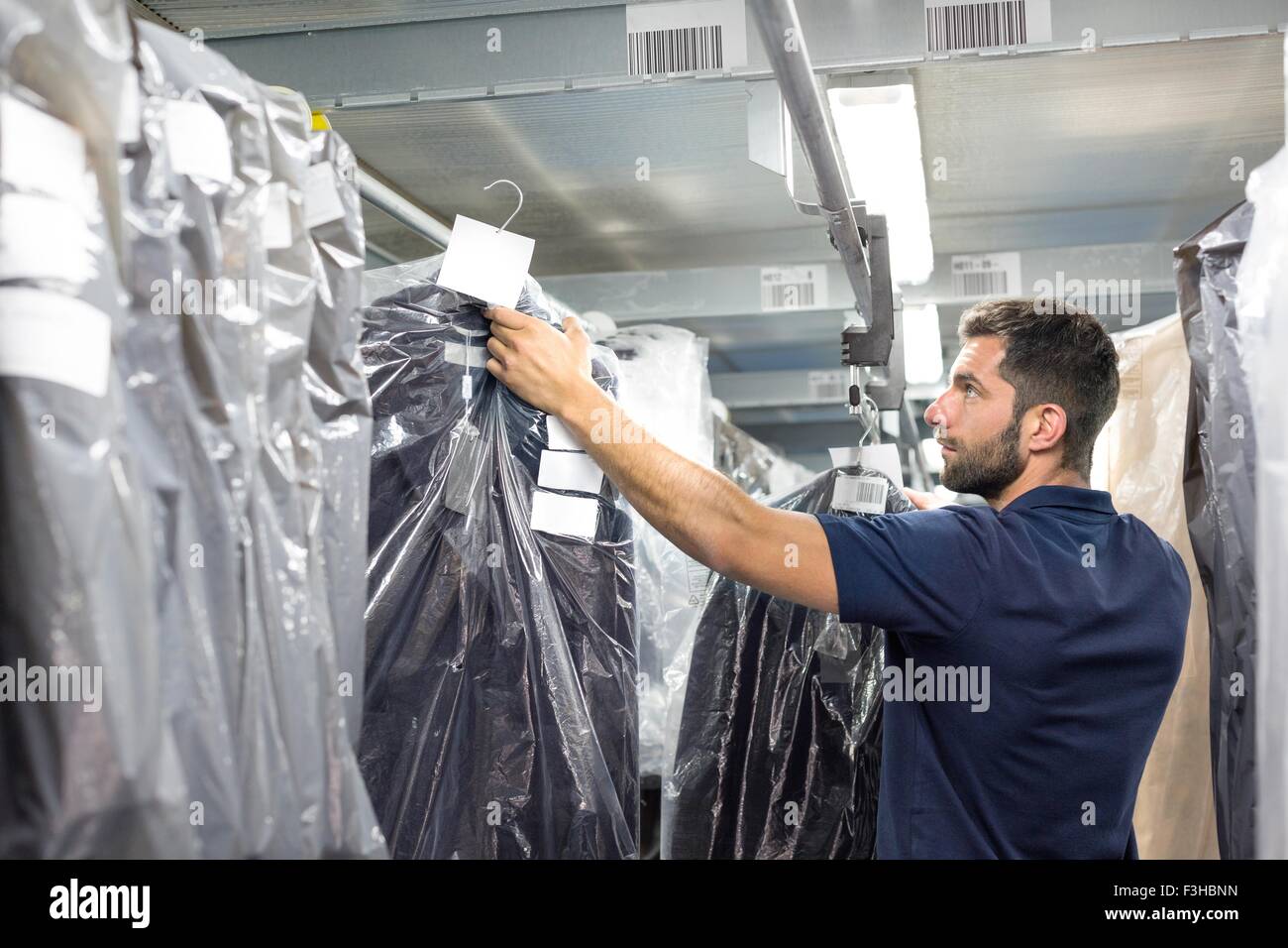 Male warehouse worker stock taking in distribution warehouse Stock ...