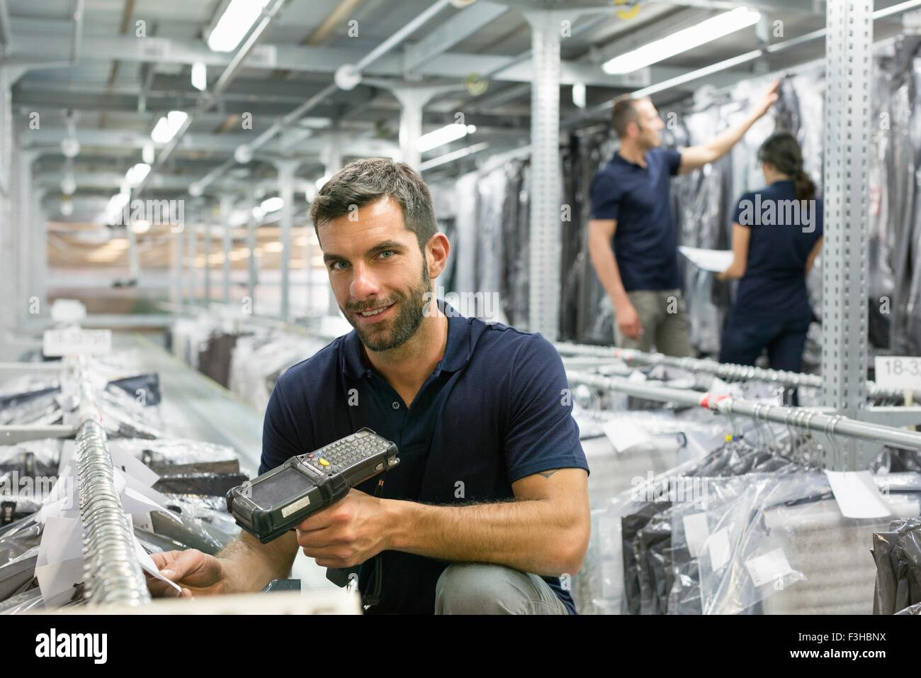 Stock take in warehouse Stock Photo - Alamy