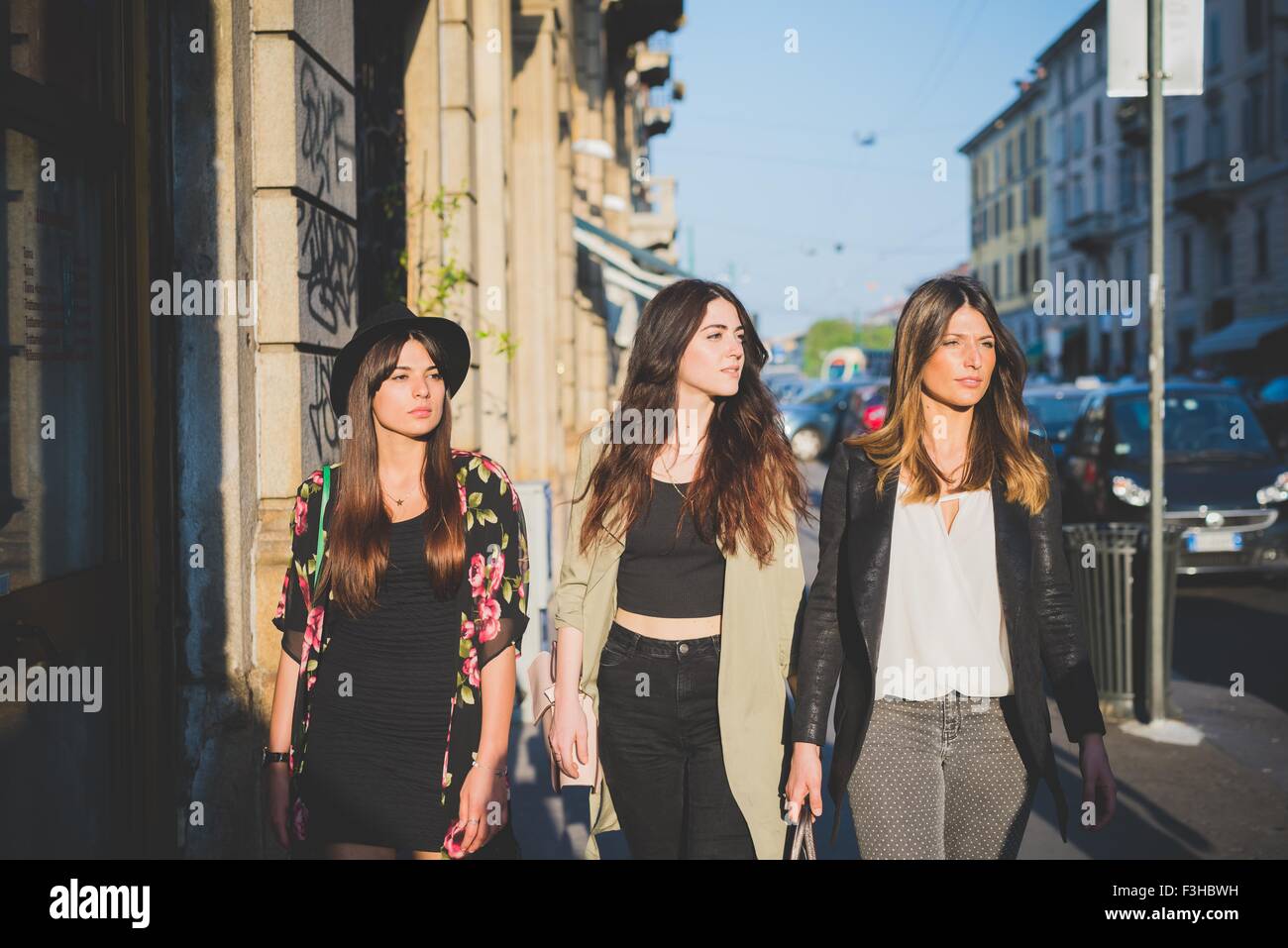 Three women on the street hi-res stock photography and images - Alamy