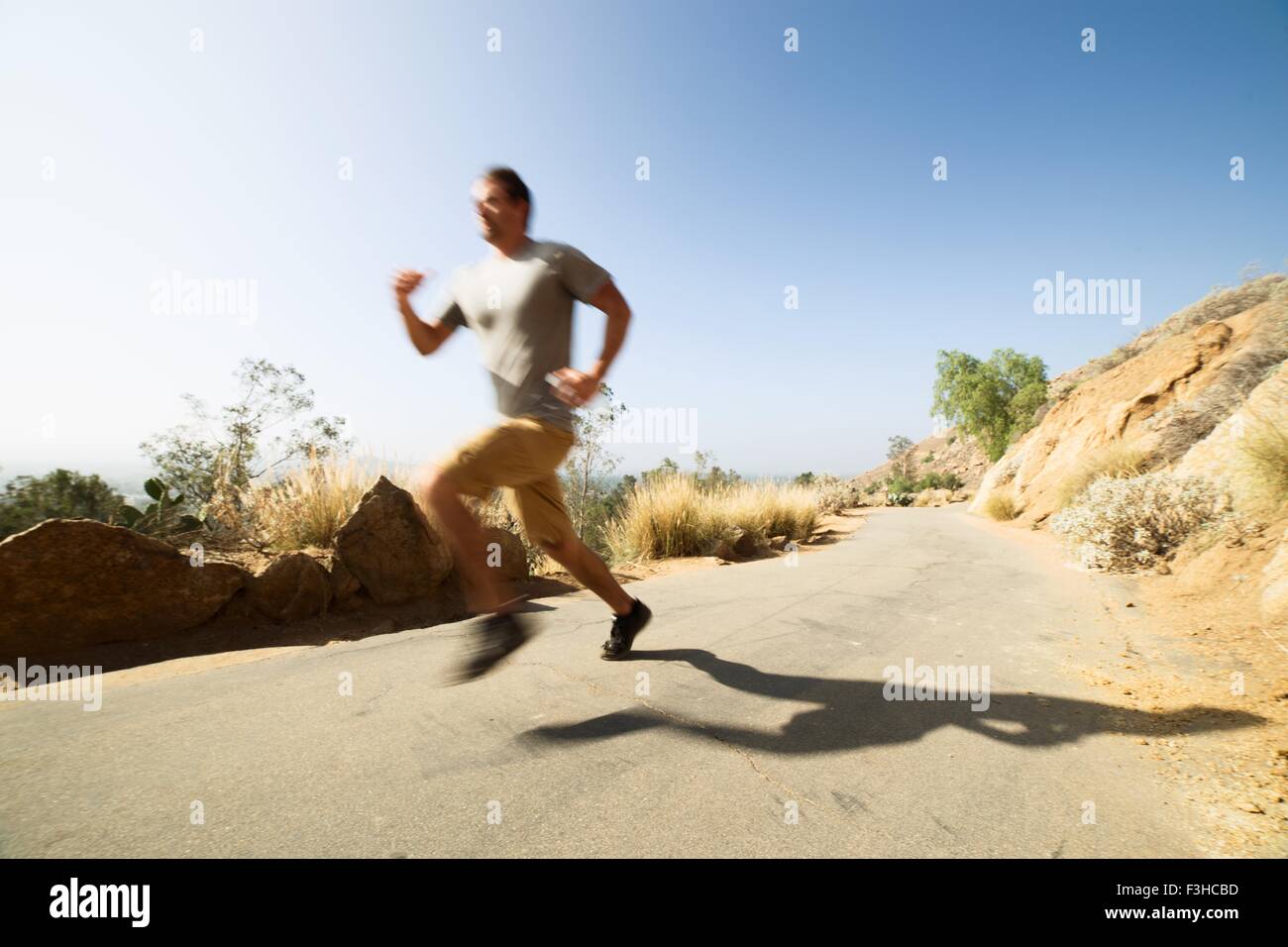 Young man, running, outdoors Stock Photo - Alamy