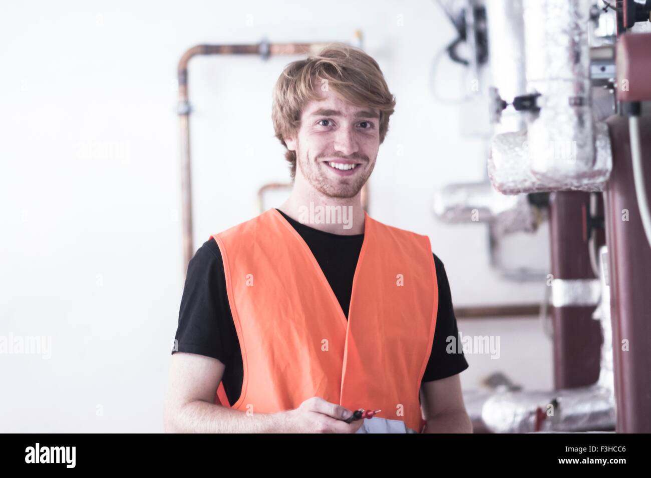 Man in boiler room working hi-res stock photography and images - Alamy