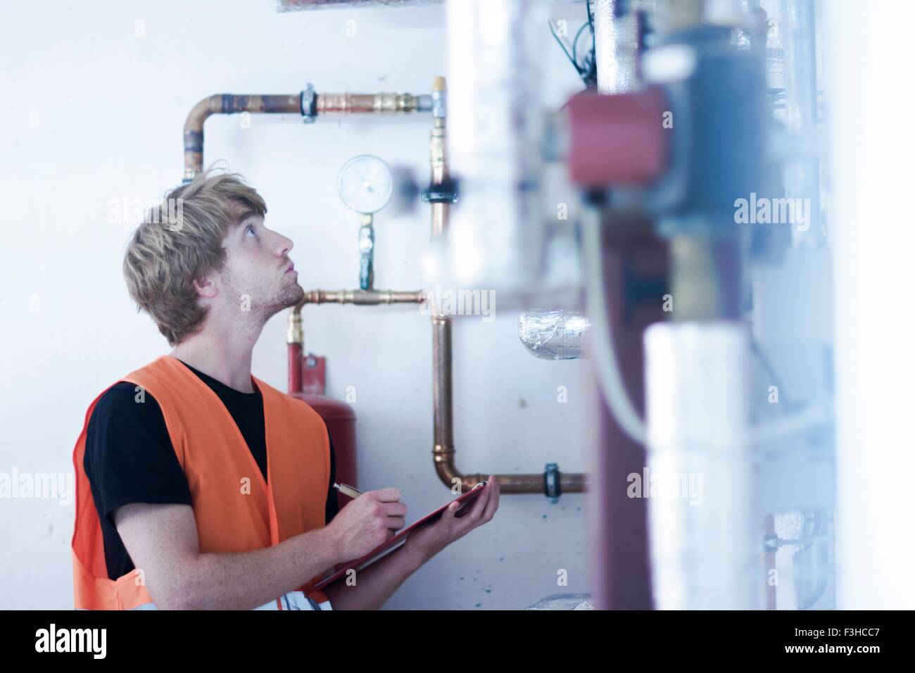 Man in boiler room working hi-res stock photography and images - Alamy