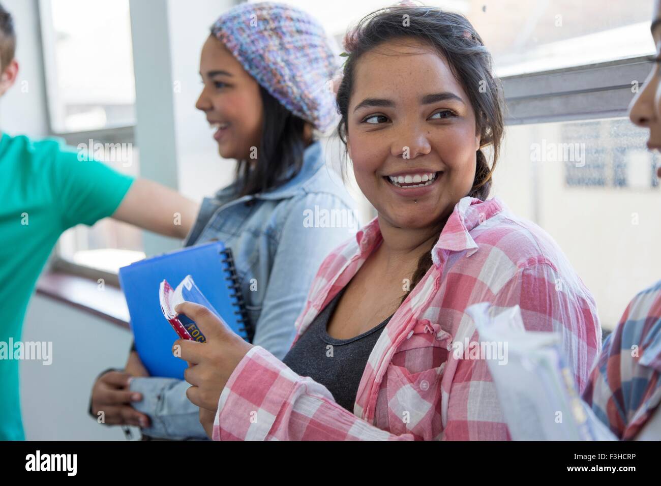 Students standing by window, chatting Stock Photo - Alamy
