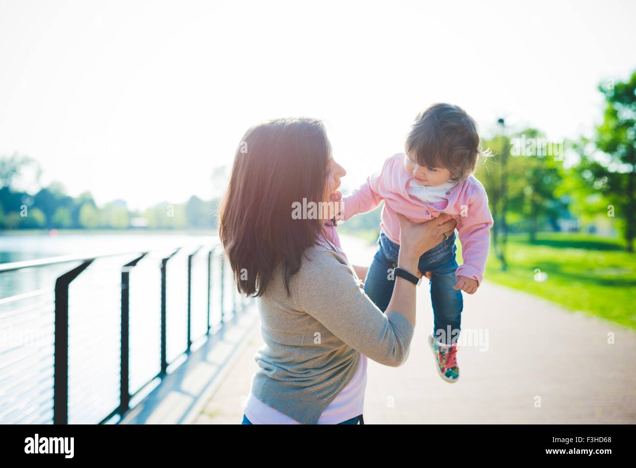 Mother lifting up daughter hi-res stock photography and images - Alamy