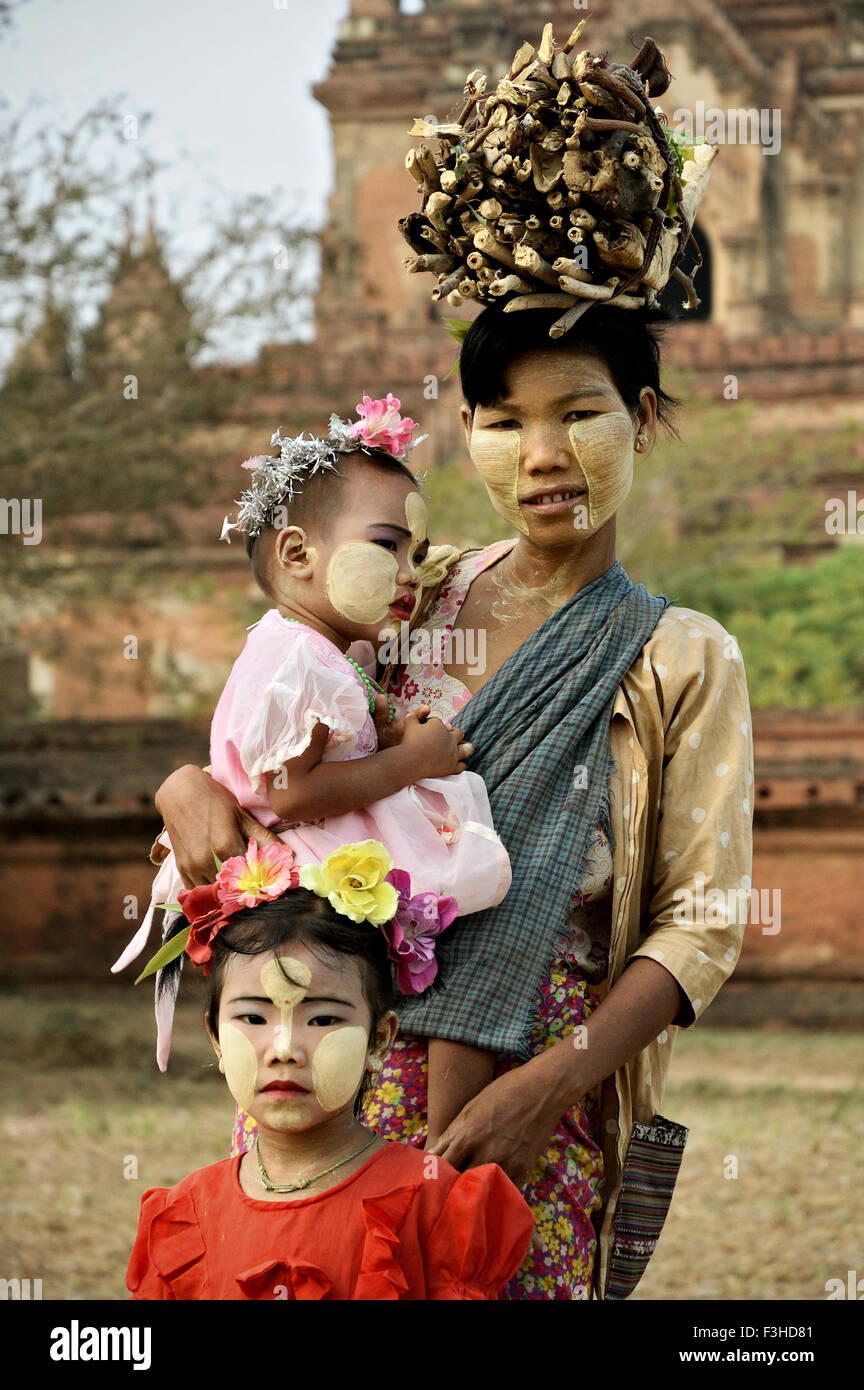 Young woman with wood on her head and thanaka face paint with her ...