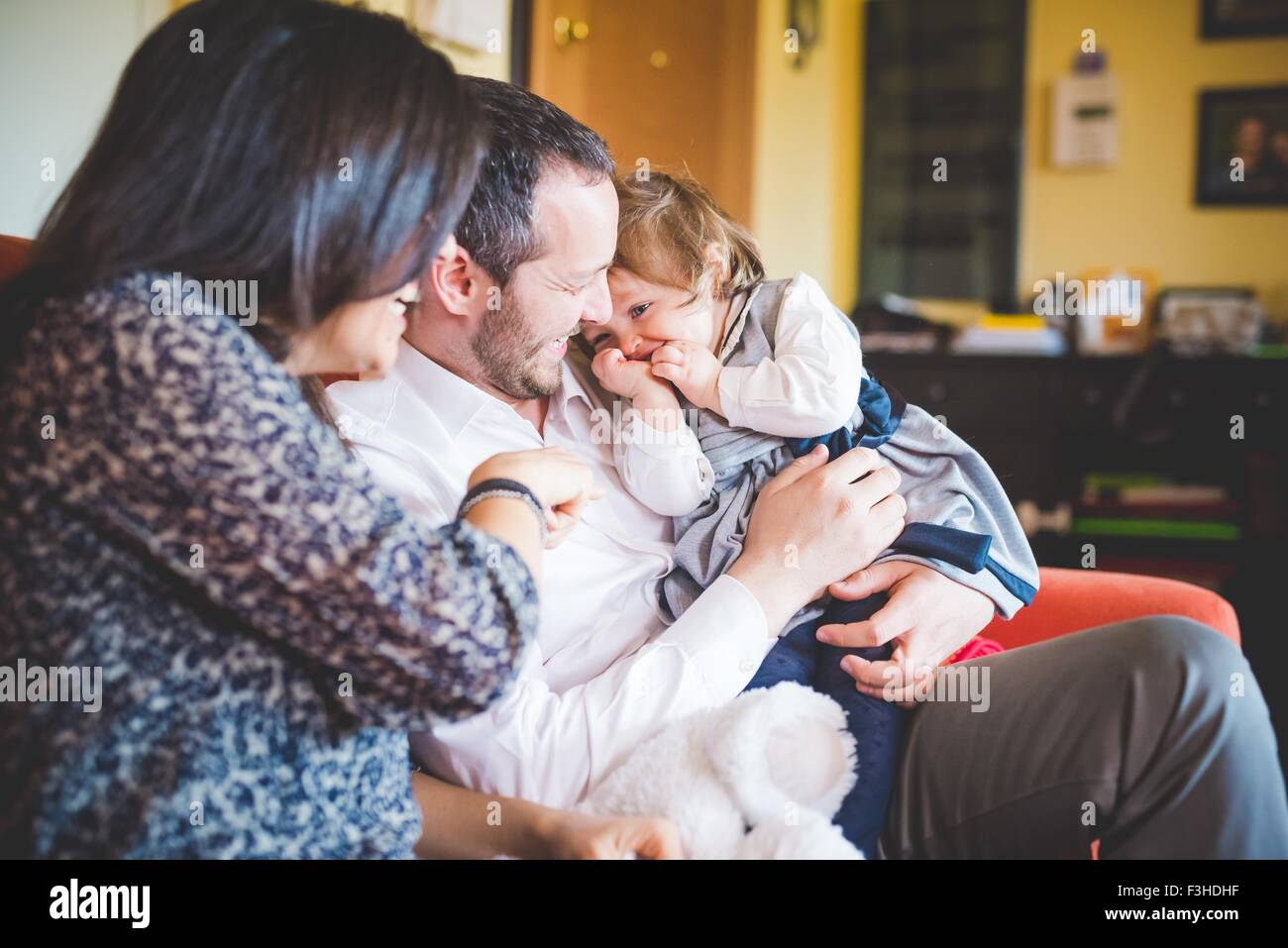 Child sitting in fathers lap hi-res stock photography and images - Alamy