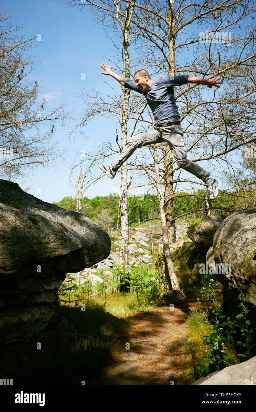 Jumping mid adult man hi-res stock photography and images - Alamy