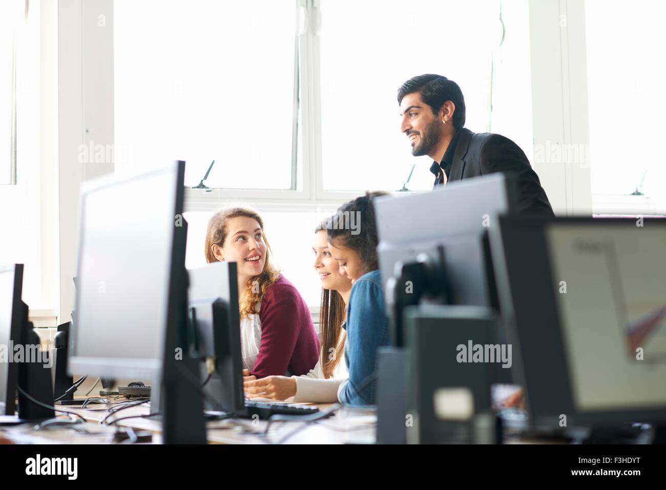 Group of students working in computer classroom Stock Photo - Alamy
