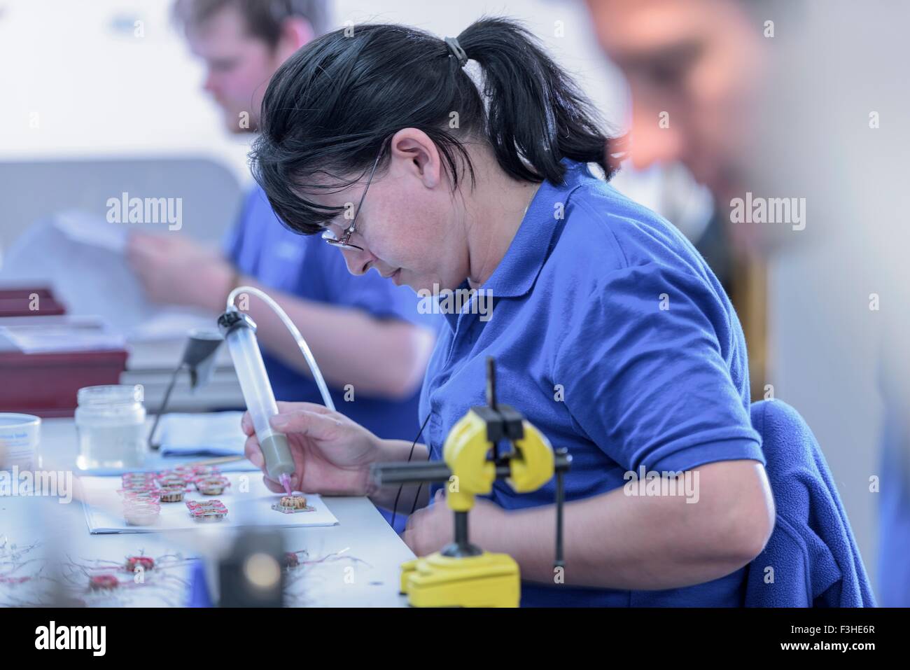 Female line worker hi-res stock photography and images - Alamy