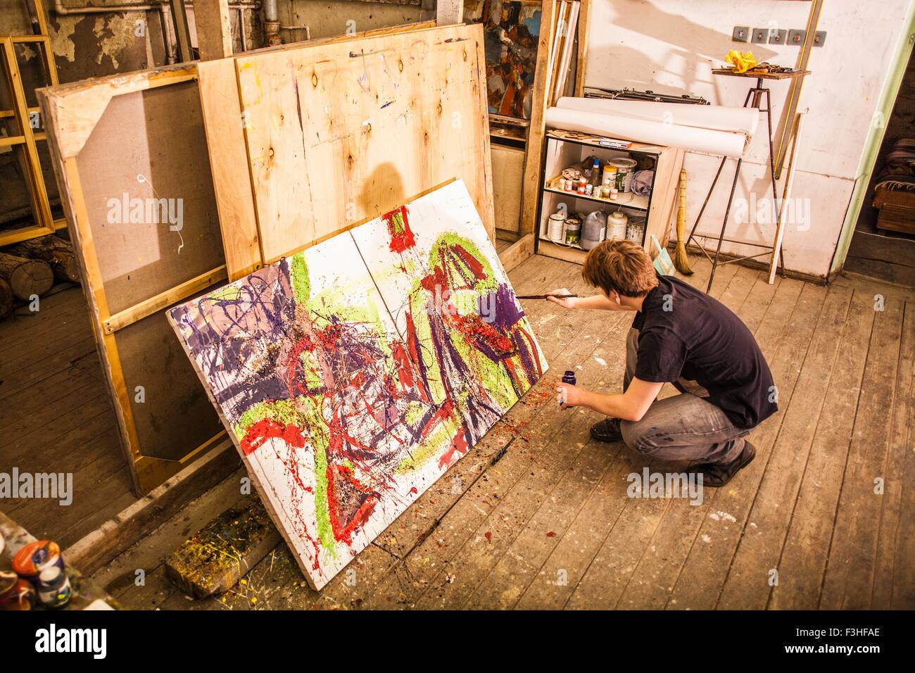 Young artist working on painting hi-res stock photography and images ...