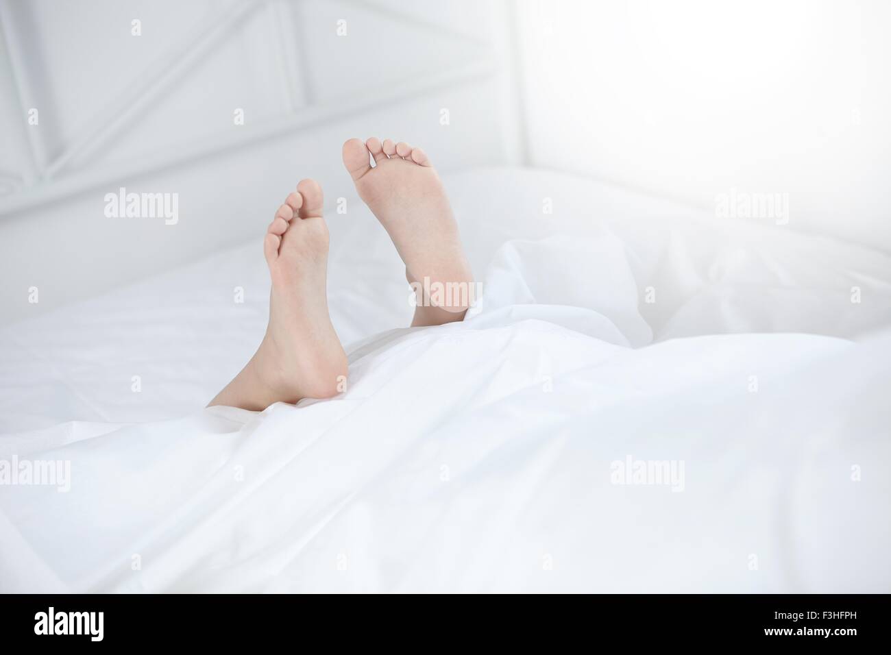 Feet Sticking Out Bed High Resolution Stock Photography and Images - Alamy