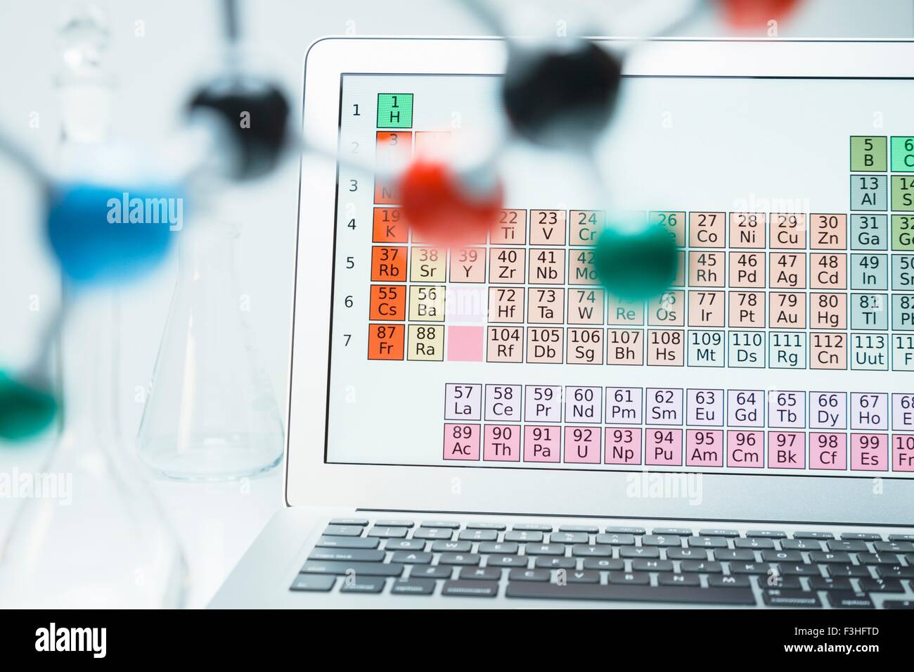 Lap top with periodic table and ball and stick molecular model Stock ...