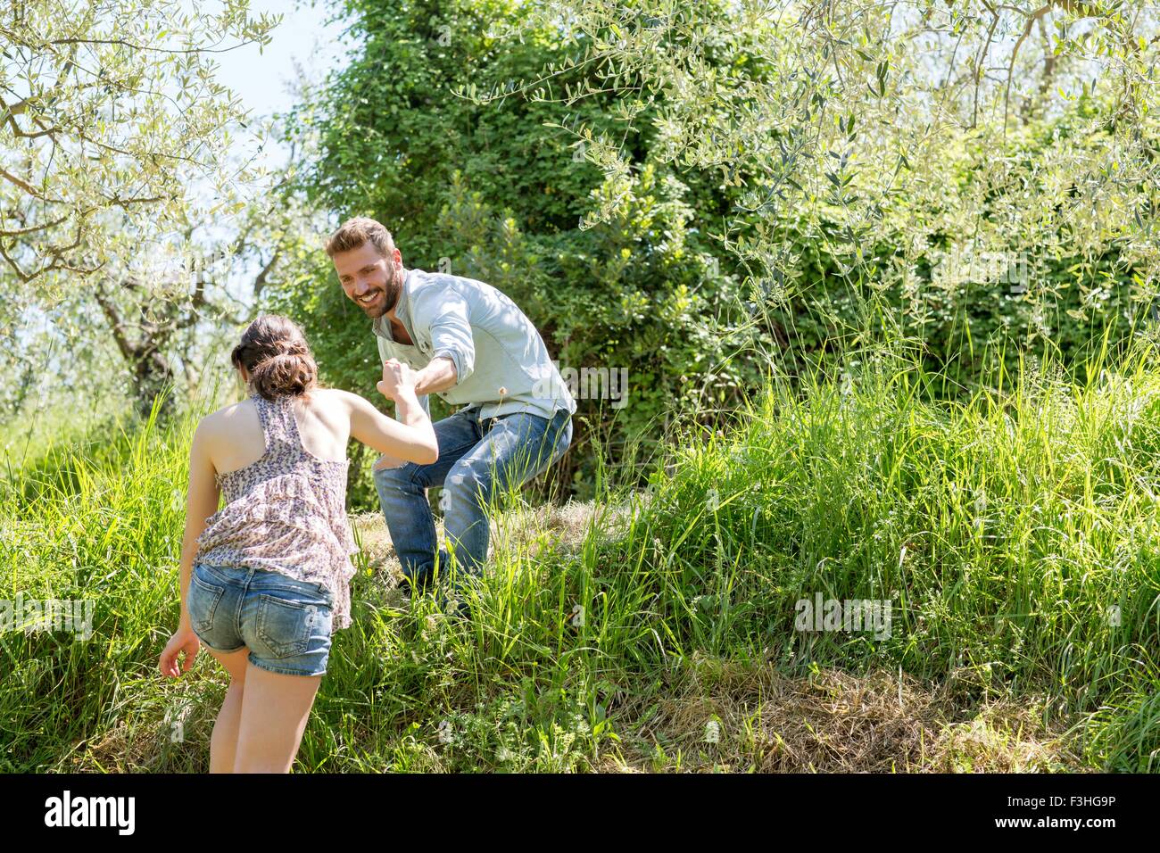 Woman helping man up from hi-res stock photography and images - Alamy