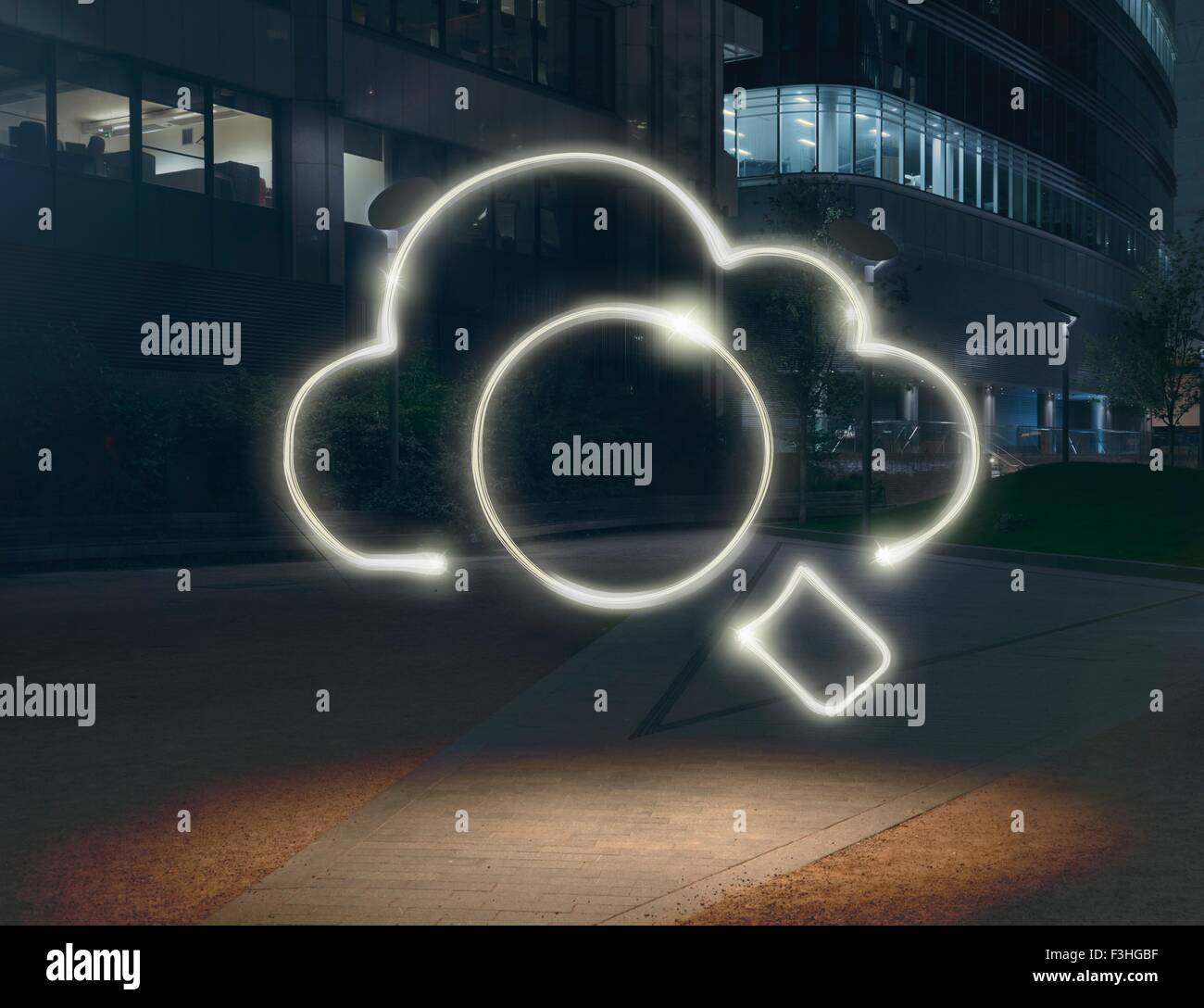 Glowing cloud symbol surrounding circle in city at night Stock Photo ...
