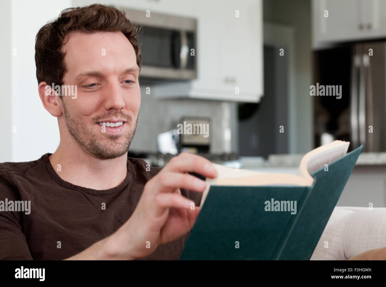 Home alone man reading hi-res stock photography and images - Alamy