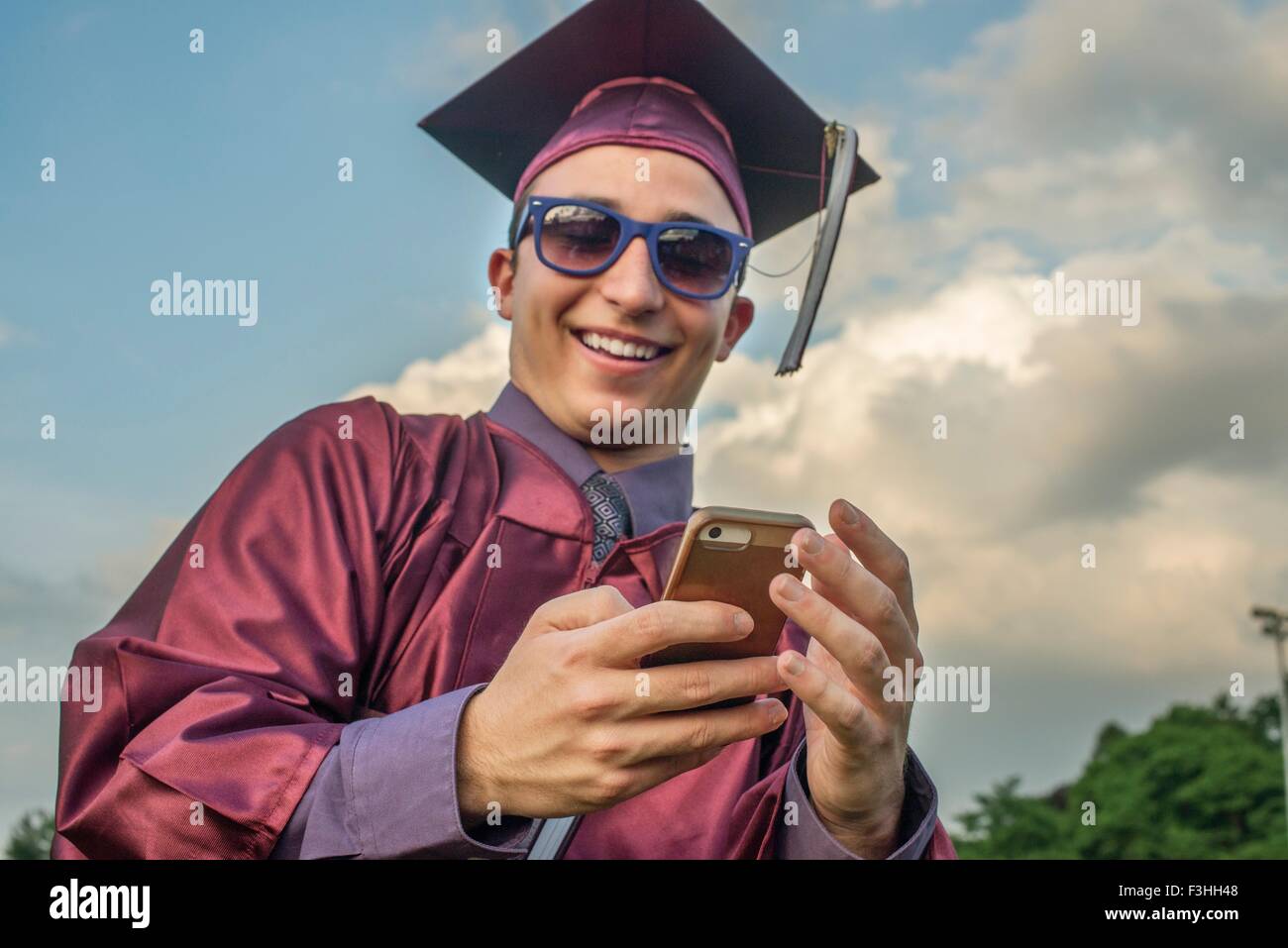 Graduate taking selfie with smartphone Stock Photo - Alamy
