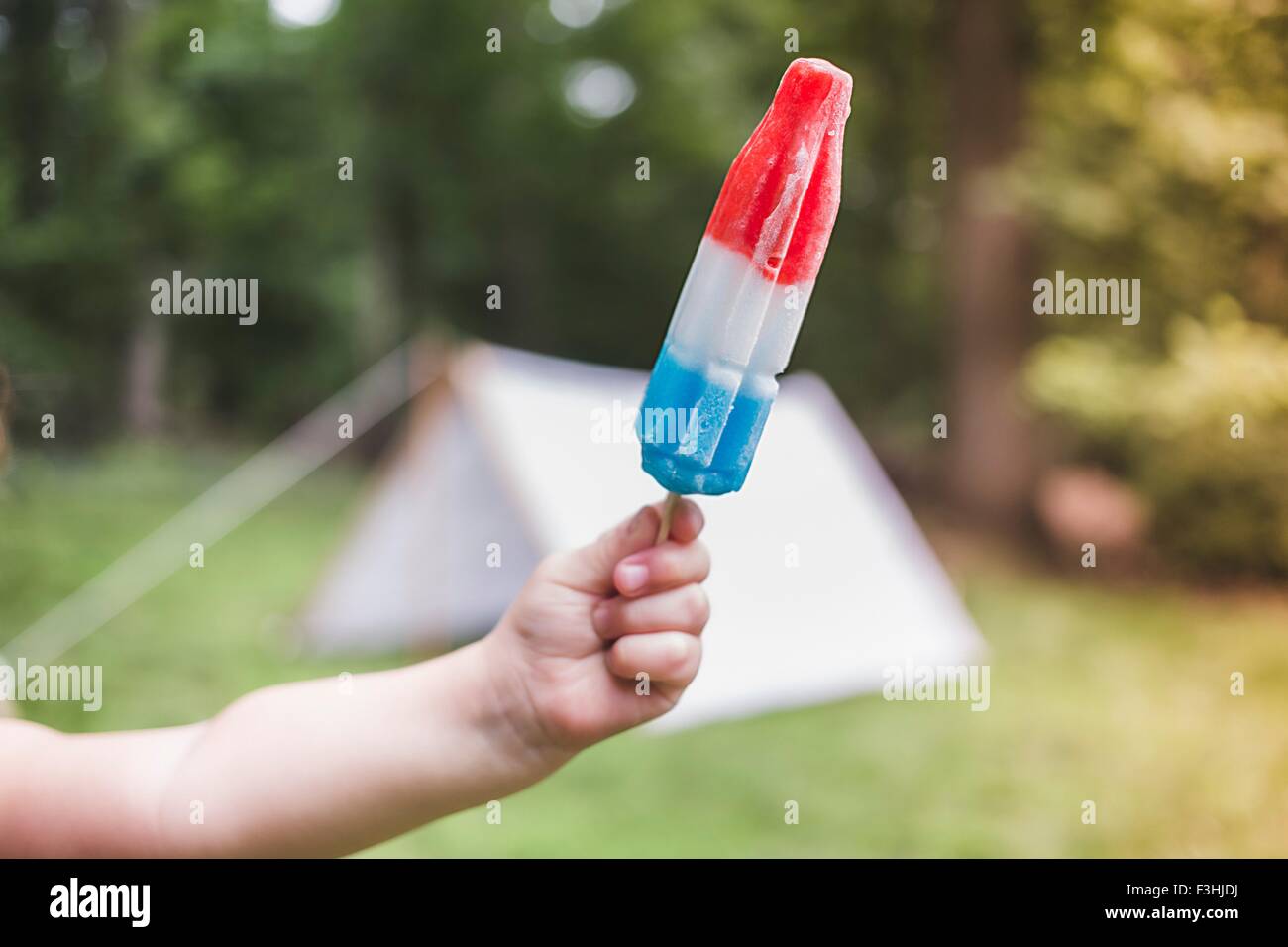 Hand holding lolly hi-res stock photography and images - Alamy