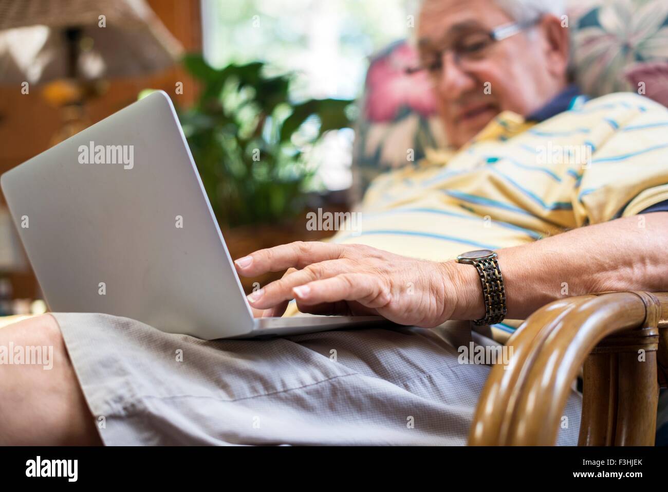Man using laptop home male hi-res stock photography and images - Alamy