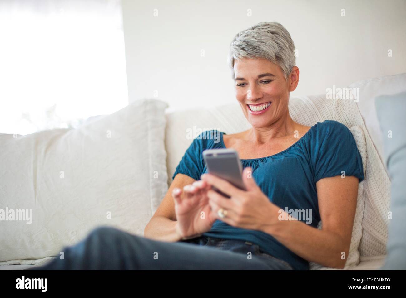 Mature woman texting hi-res stock photography and images - Alamy