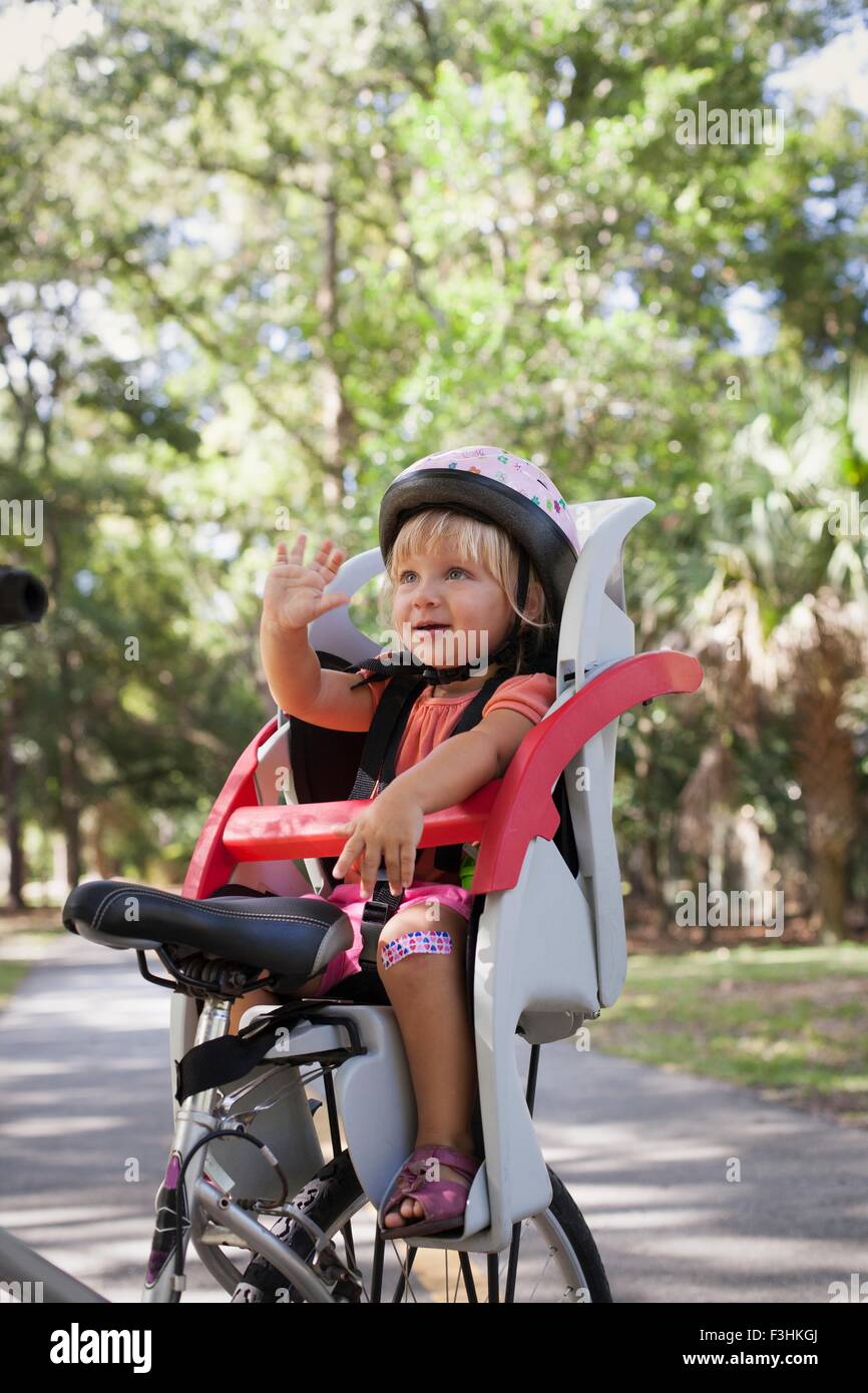 Girl sitting on bicycle in hi-res stock photography and images - Alamy