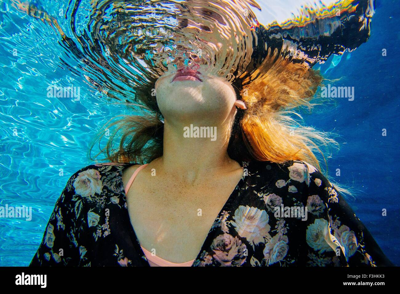 Young woman underwater, breaking through water surface Stock Photo - Alamy Young woman underwater, breaking through water surface Stock Photo - Alamy