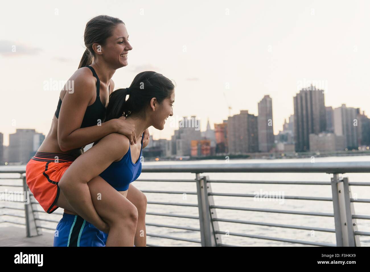 Two Women Standing Back To Back High Resolution Stock Photography and ...