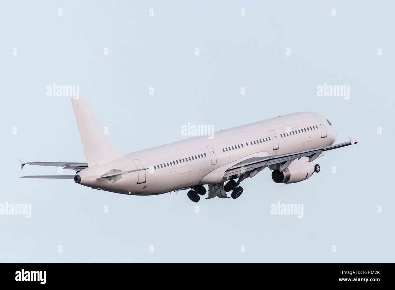 Passenger aircraft just after take off at the airport Stock Photo - Alamy