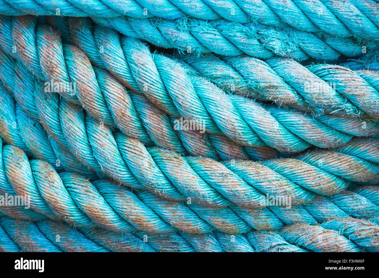 Close up detail of worn coiled blue rope Stock Photo - Alamy