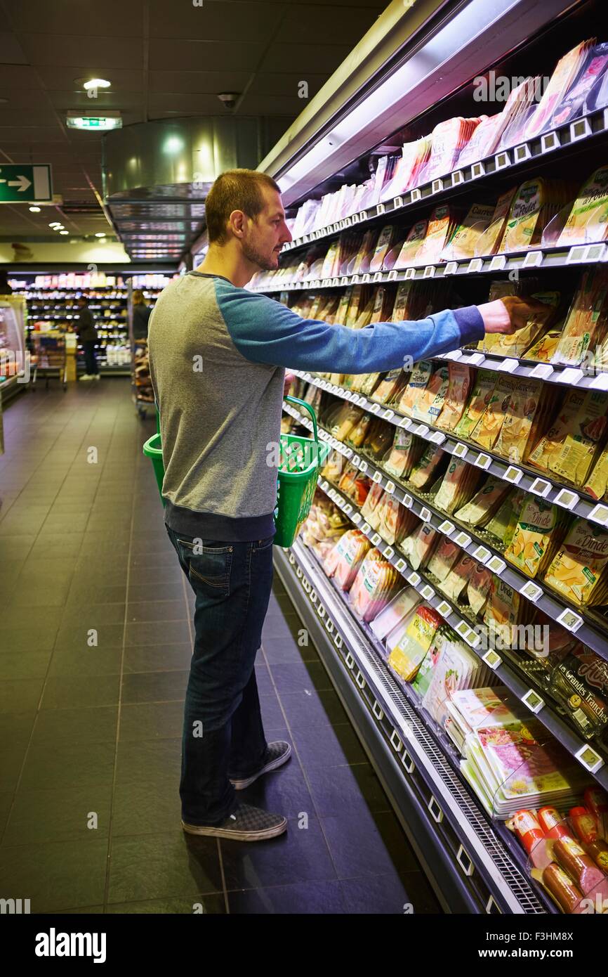 Man shopping in supermarket Stock Photo - Alamy