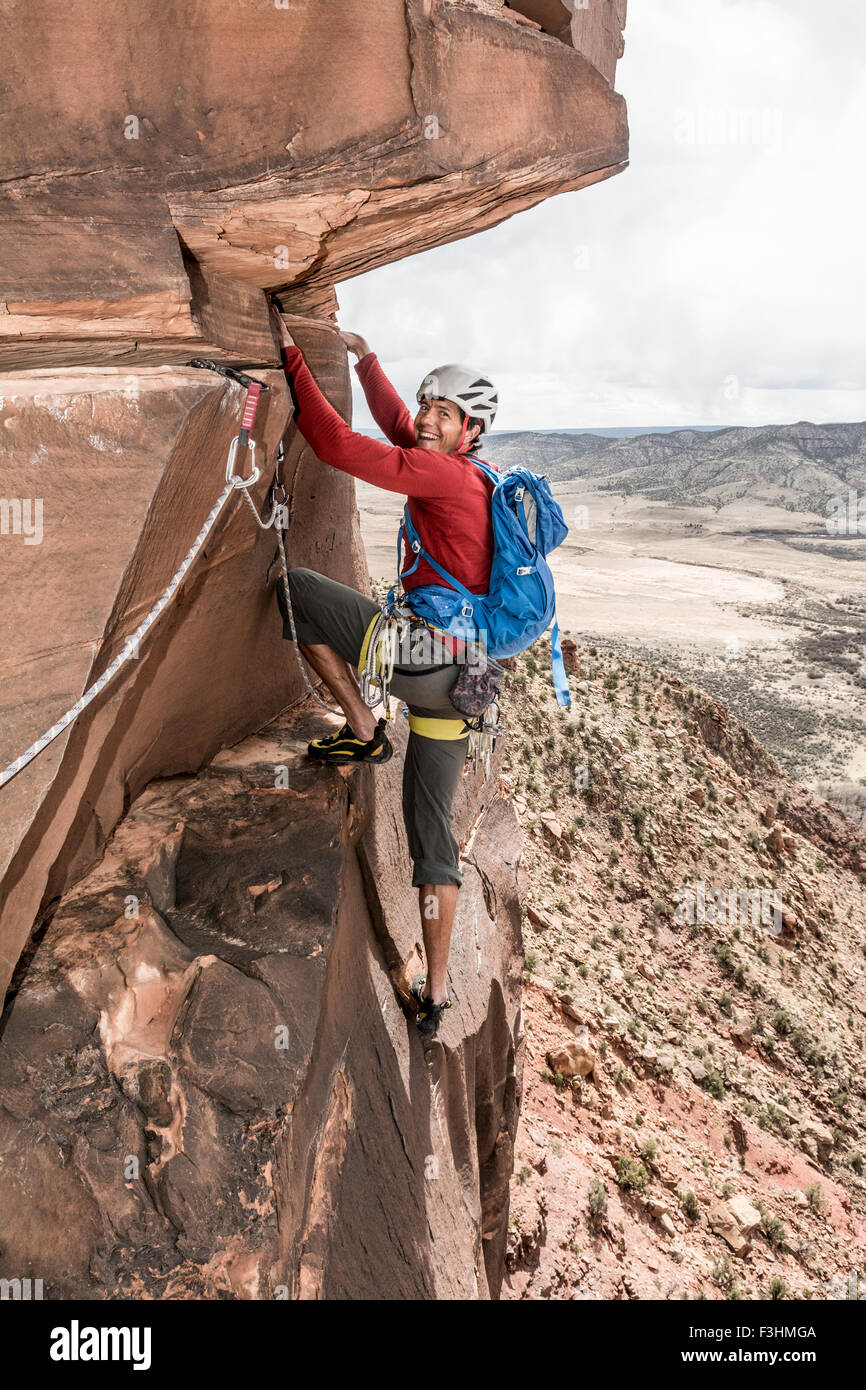 A man rock climbing a desert sandstone tower, Naturita, Colorado Stock ...