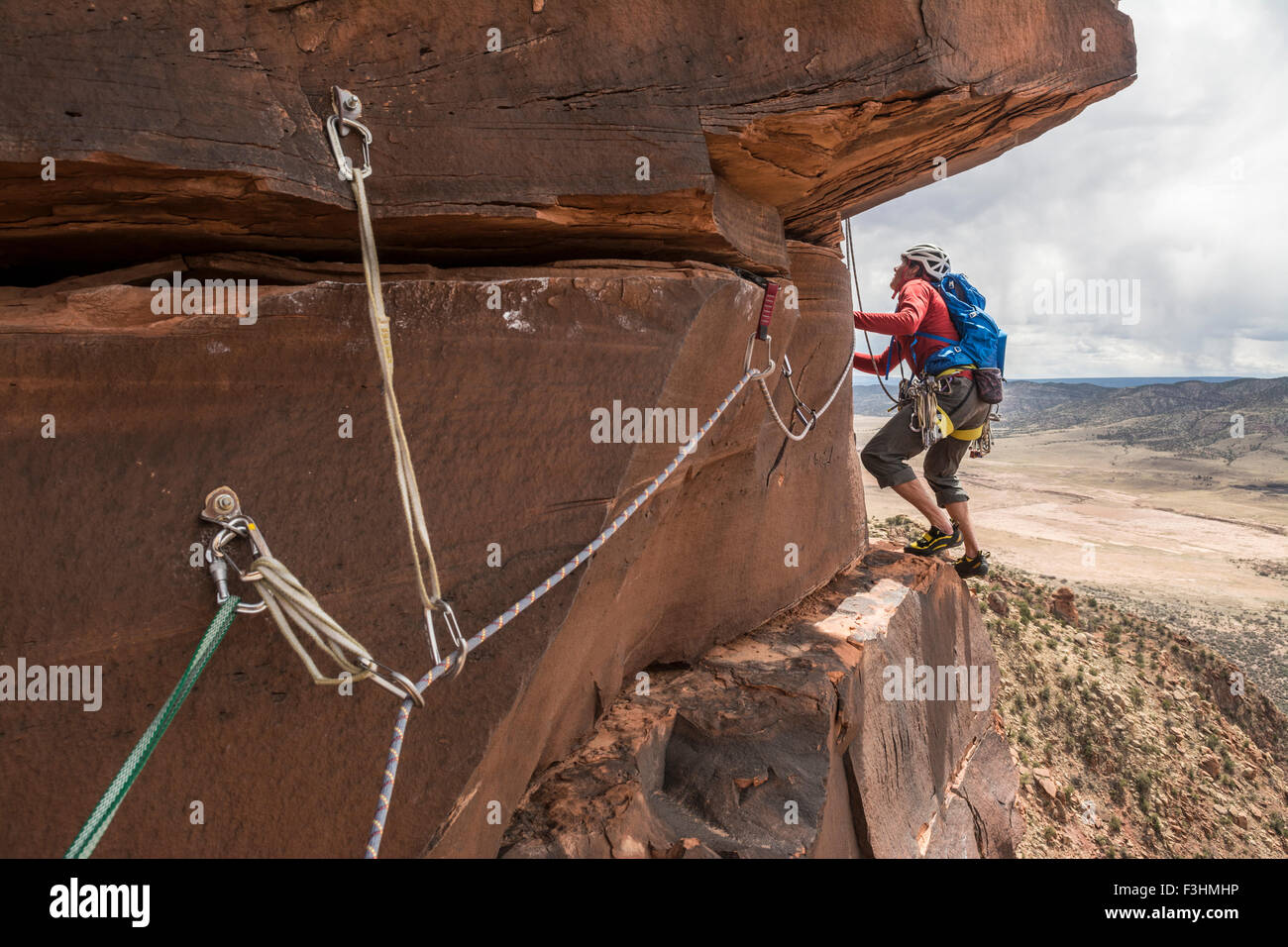A man rock climbing a desert sandstone tower, Naturita, Colorado Stock ...