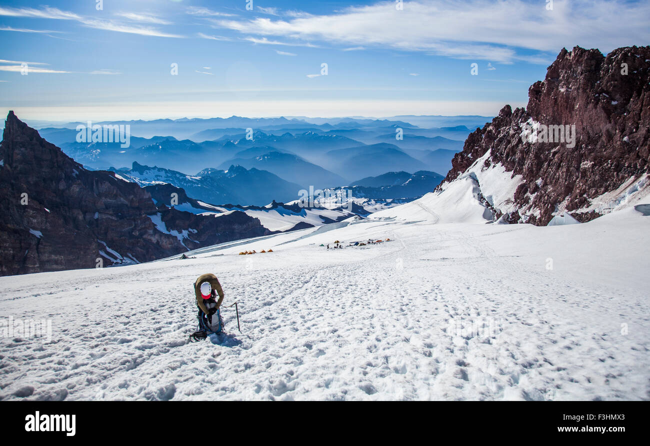 A climber ascends Mount Rainier in Mount Rainier National Park ...