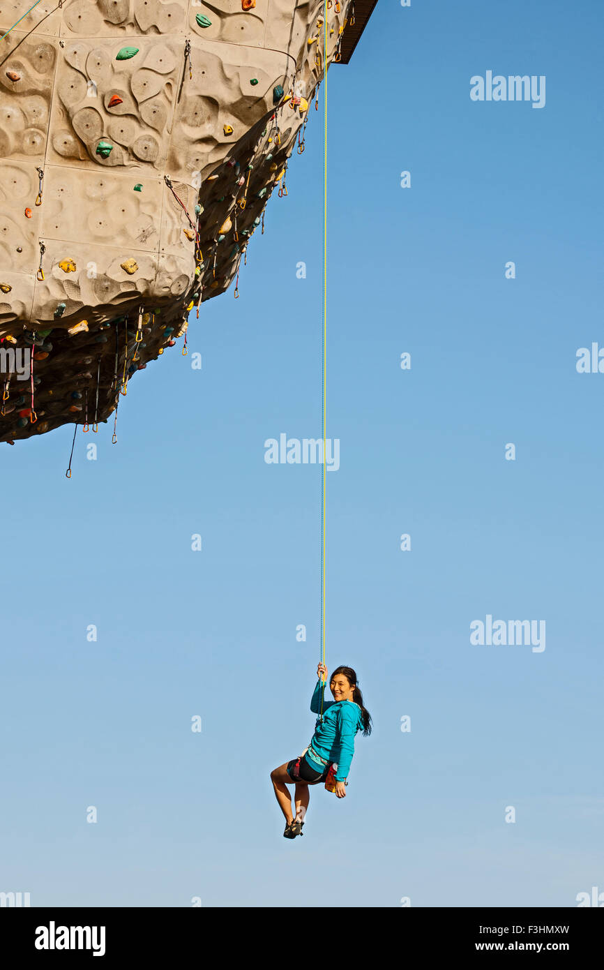 Woman climbing on artificial climbing wall in Seoul Stock Photo - Alamy
