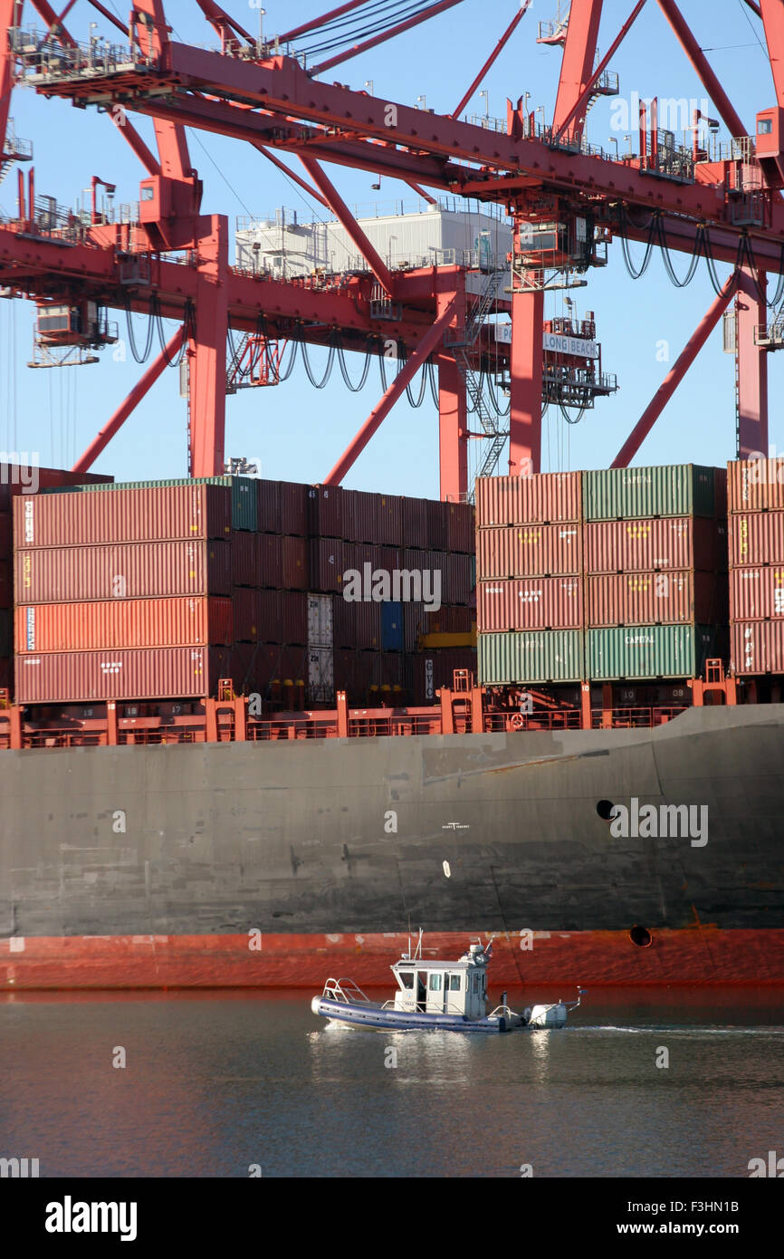 homeland security boat and freighter Stock Photo - Alamy