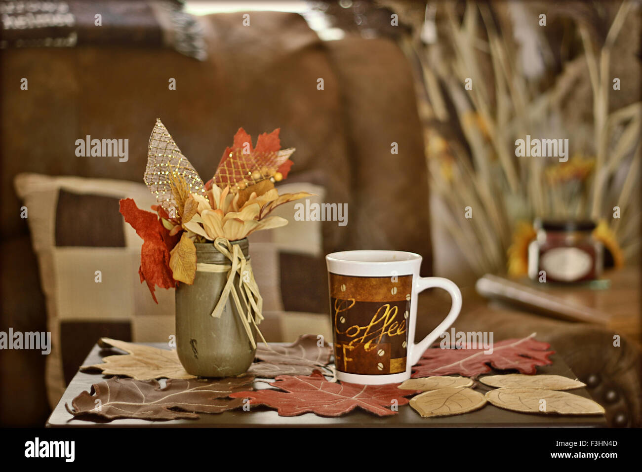 Cup of coffee with fall decor Stock Photo - Alamy