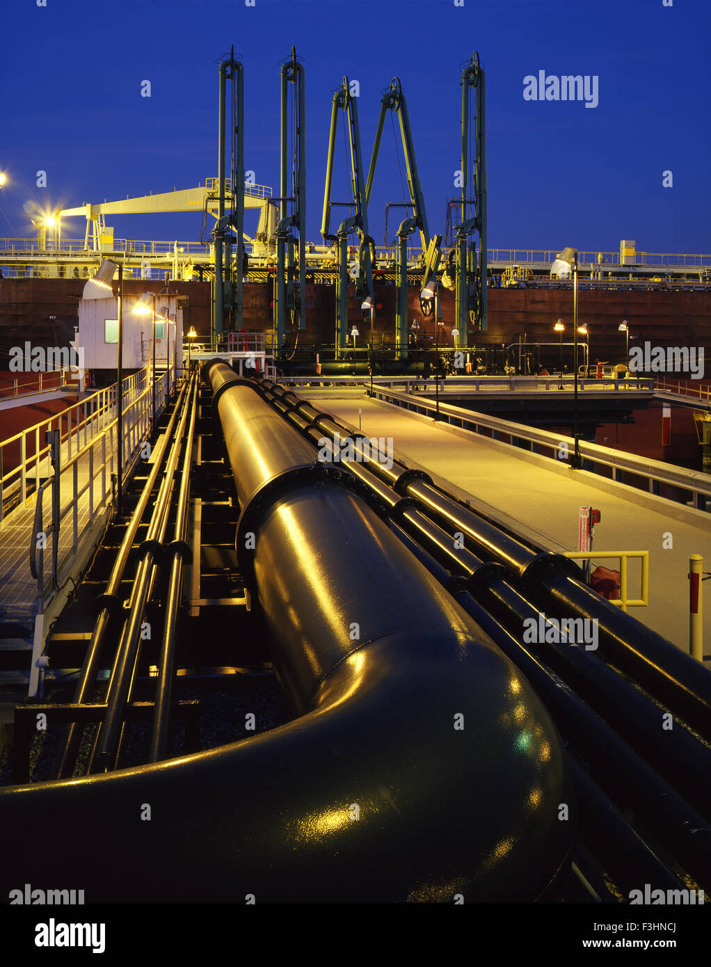 piping at an oil transfer facility with ship Stock Photo - Alamy