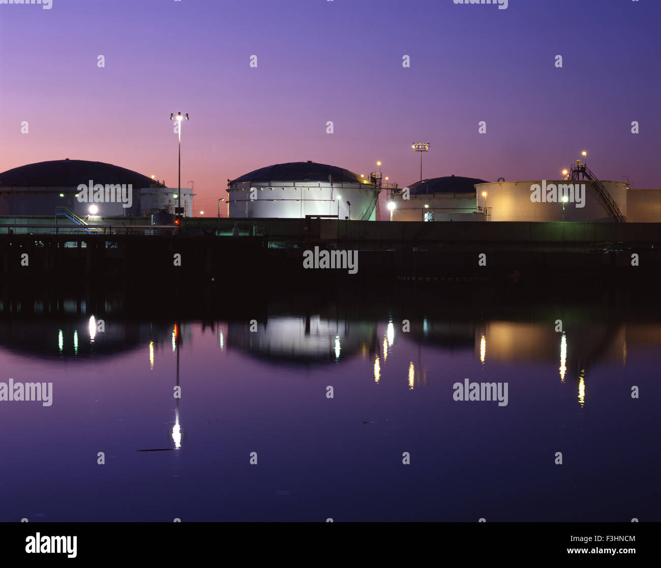 oil tank farm at night Stock Photo - Alamy