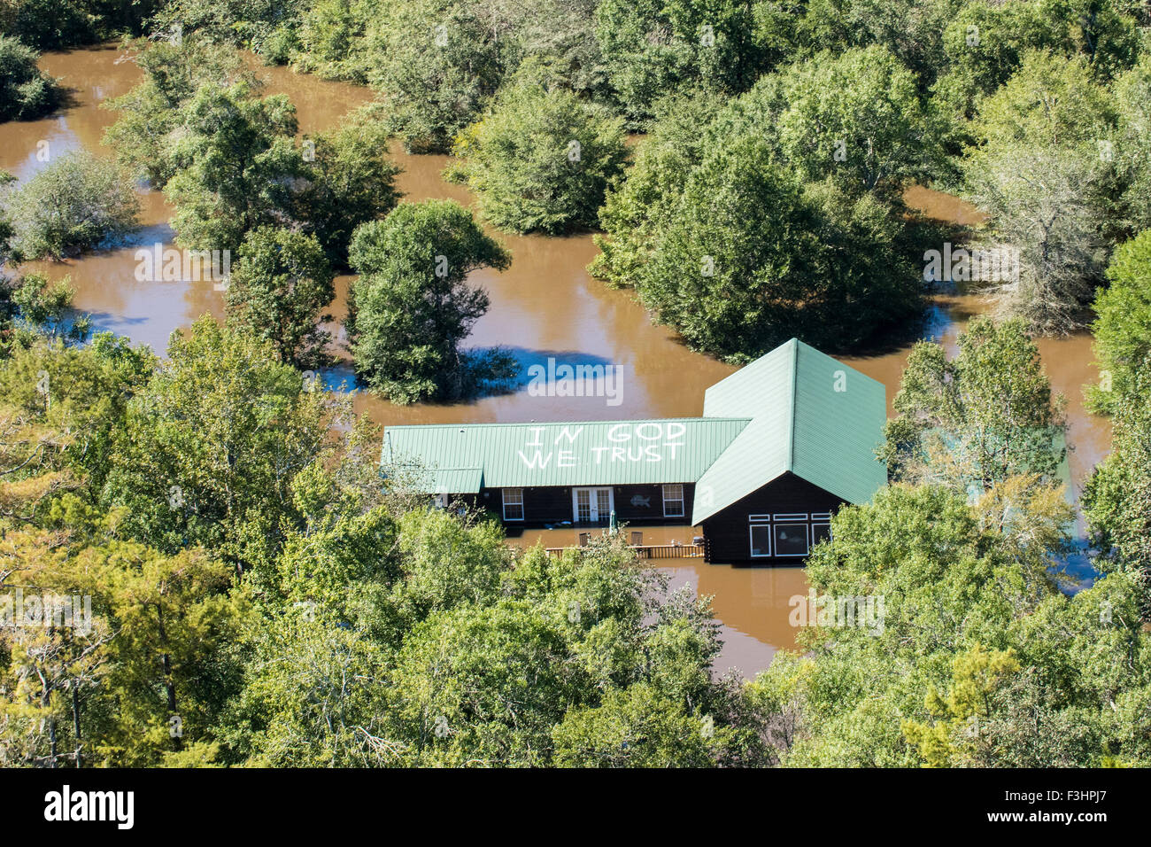 Aerial view of floodwaters submerging a home after record breaking ...