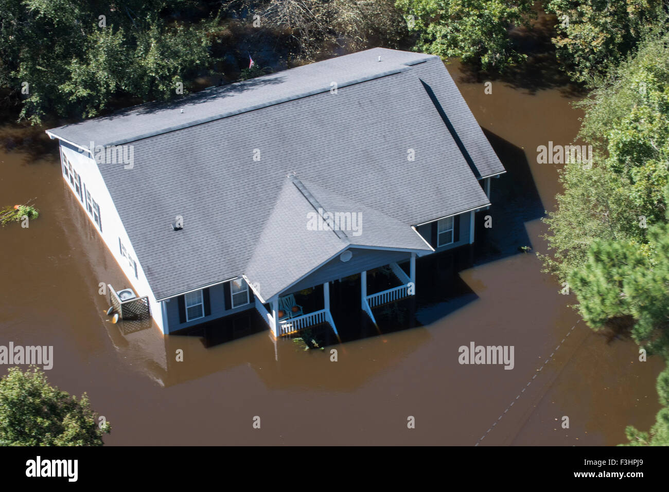 Aerial view of floodwaters submerging a home after record breaking ...