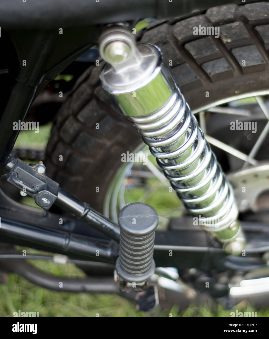 Motor Bike Shock Absorber and foot rest Stock Photo - Alamy