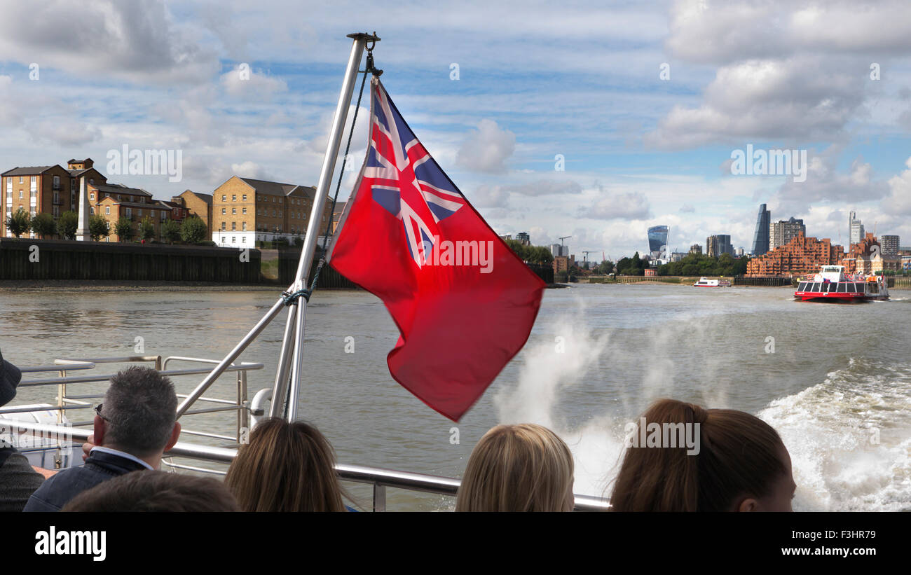 Cruising on Thames Clipper river boat with 'red duster' flag and ...