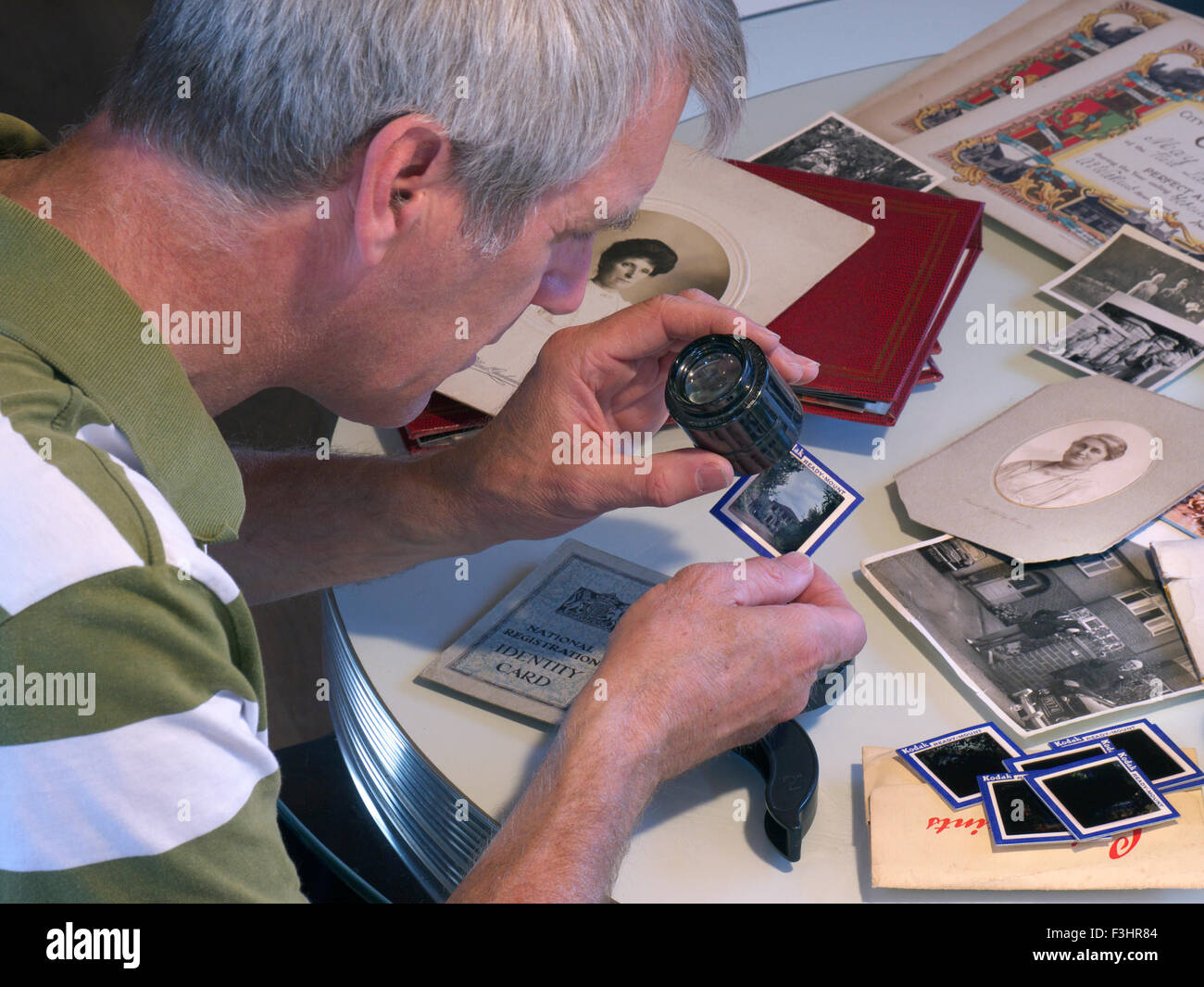 Sorting through photographs hi-res stock photography and images - Alamy