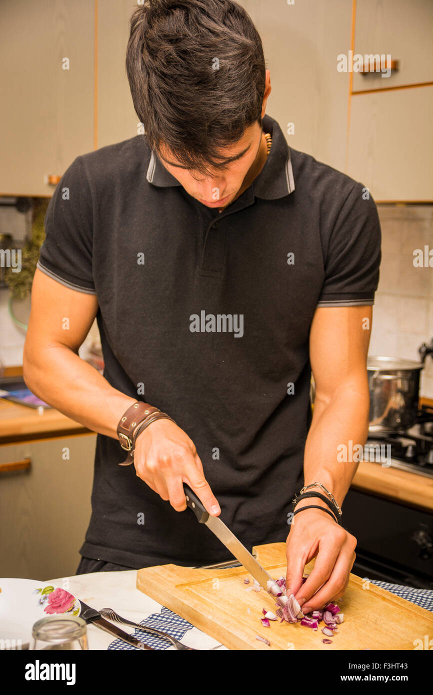 Waist Up of Attractive Young Man with Dark Hair, Chopping Red Onion ...